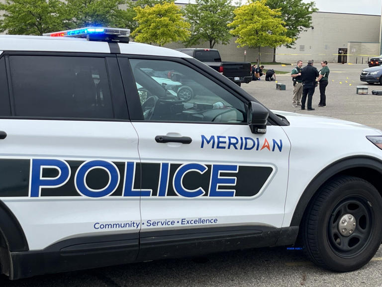Woman arrested, 2 injured after shooting near Meridian Mall