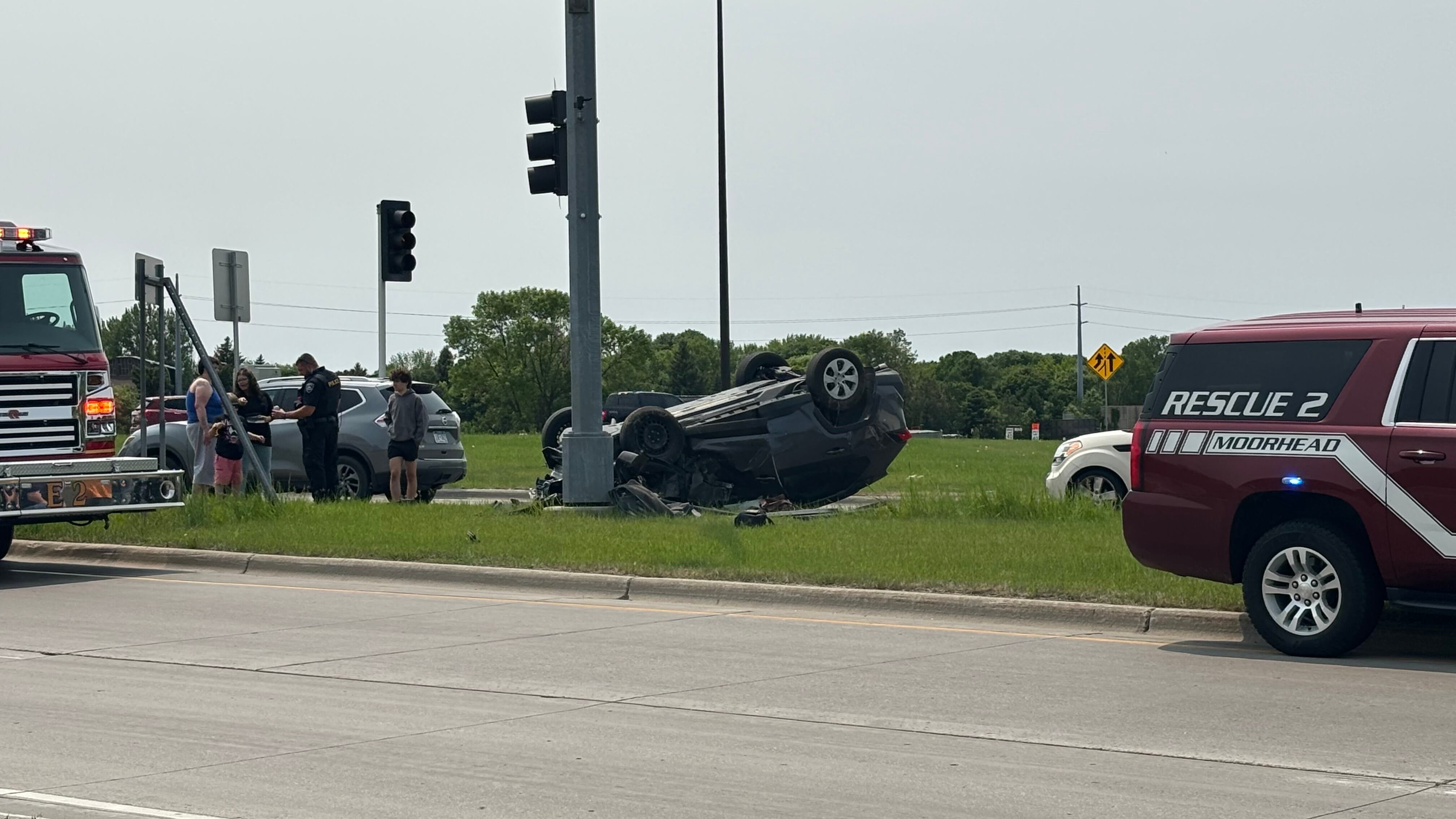 Update: Driver hospitalized after vehicle flips onto roof in Moorhead