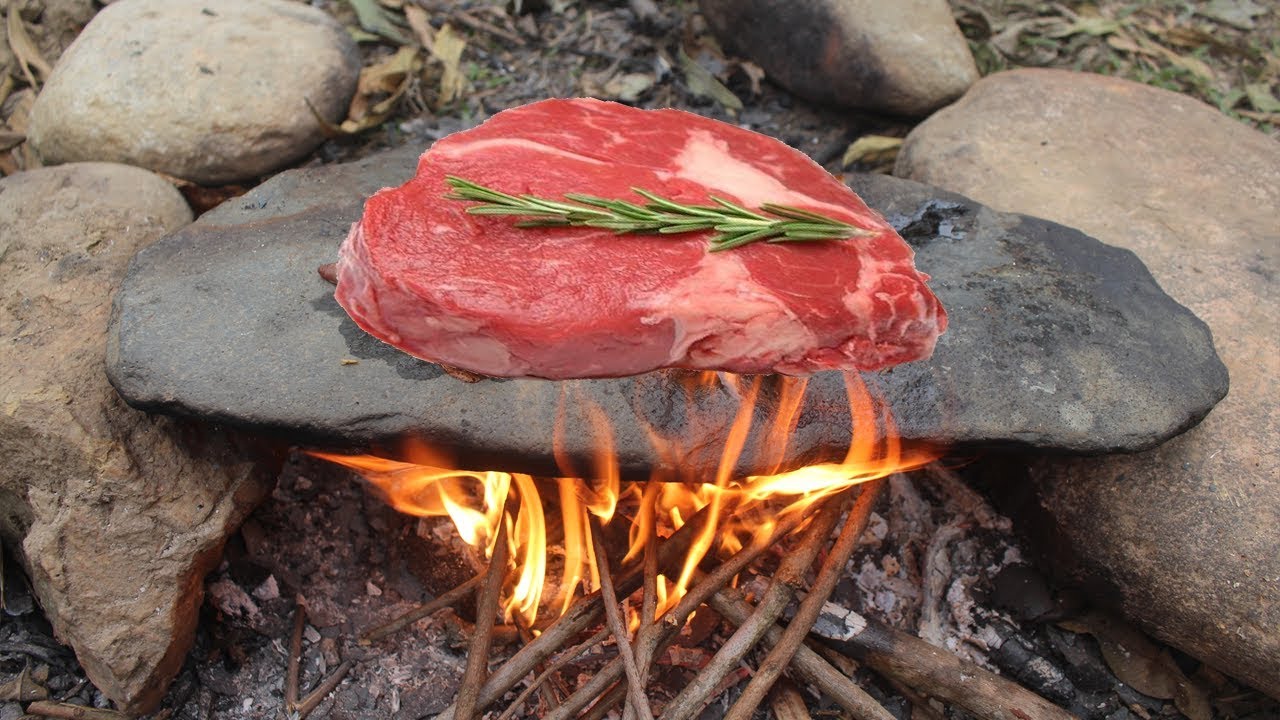 Primitive cooking on a hot rock