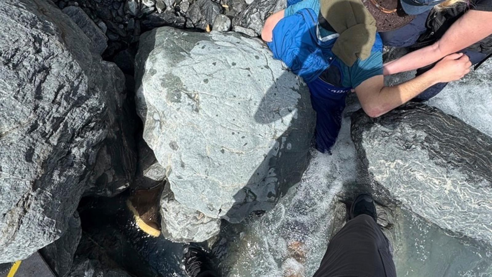 Man survives being pinned down by 700-pound boulder for 3 hours in ...