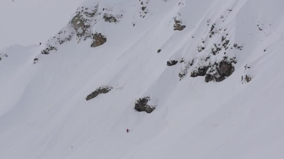 Guy Skis Down Mountain Slope and Crashes on Boulder