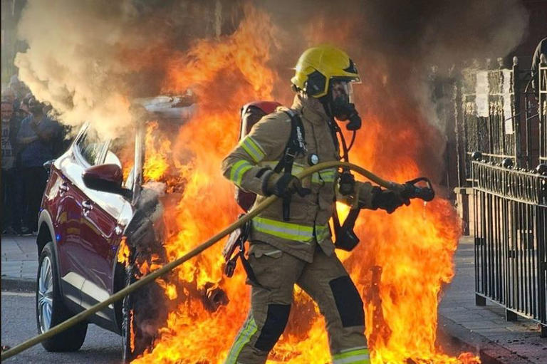 Car bursts into flames on busy main road