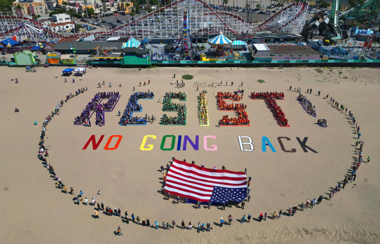 Photos | More than a thousand people gather at Main Beach in Santa Cruz ...