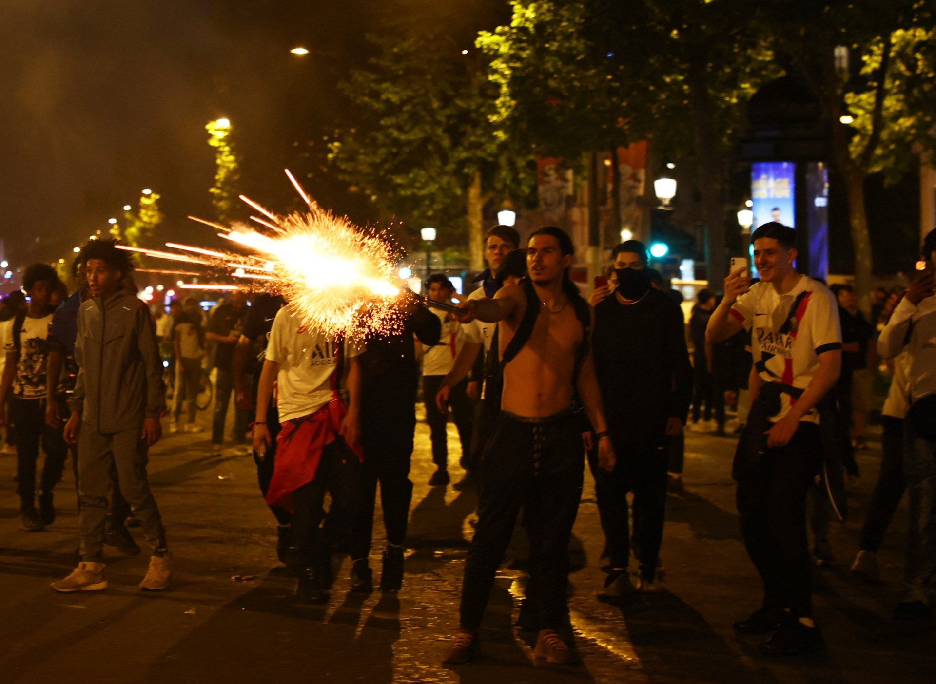 Masked fans hurl fireworks at riot police in Champions League final clash