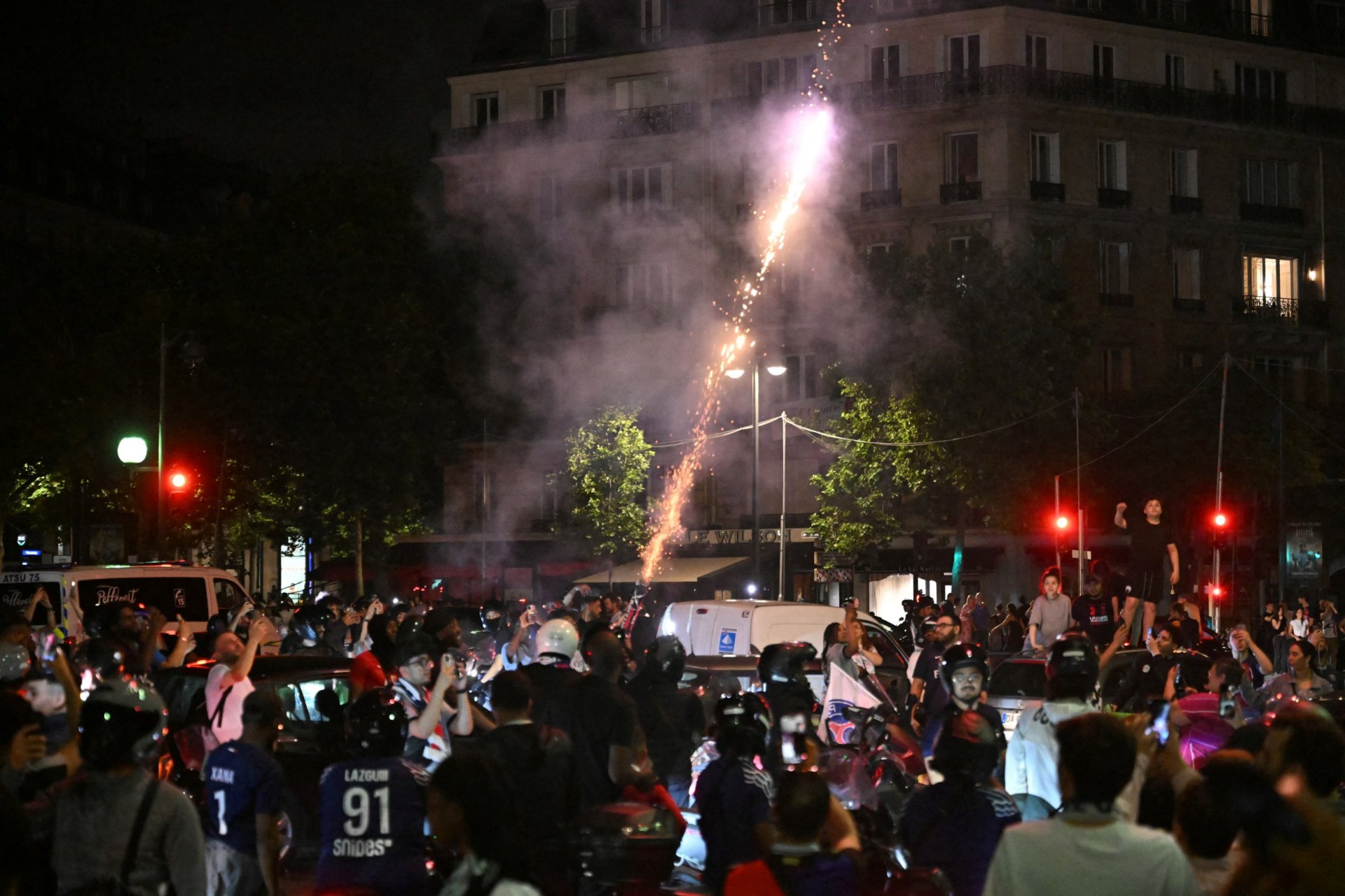 Masked fans hurl fireworks at riot police in Champions League final clash