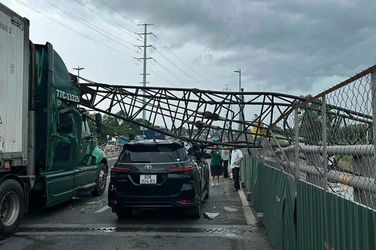 Violent gales slam Ho Chi Minh City, toppling crane, uprooting trees
