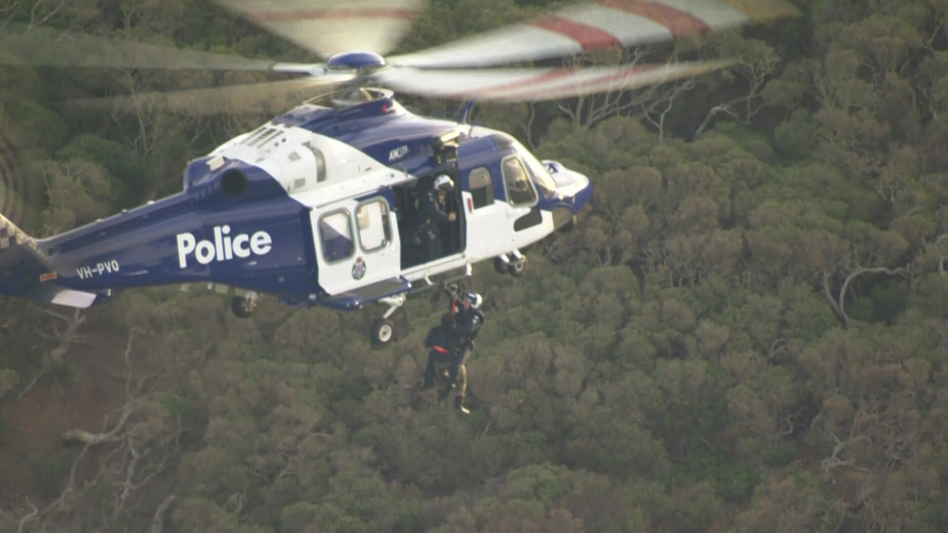 Emergency services winch man to safety in Great Ocean Road cliff rescue