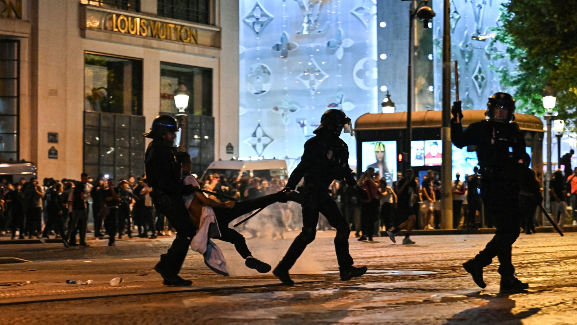 Chaos on the streets of Paris as riot police and tear gas deployed