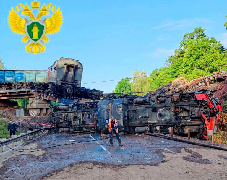 Seven dead in train crash after 'explosions' destroy bridges on Ukraine ...