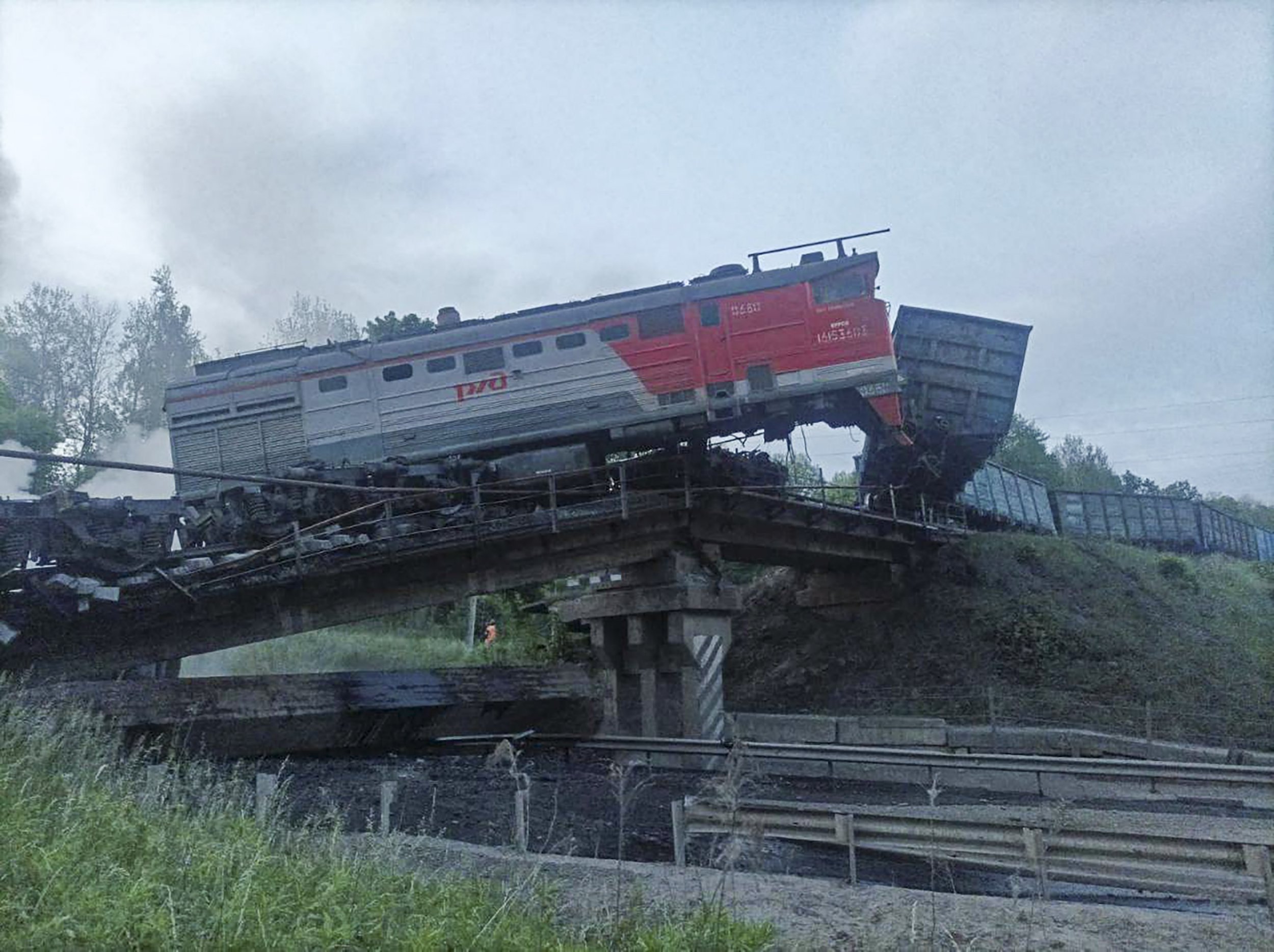 Seven dead in train crash after 'explosions' destroy bridges on Ukraine ...