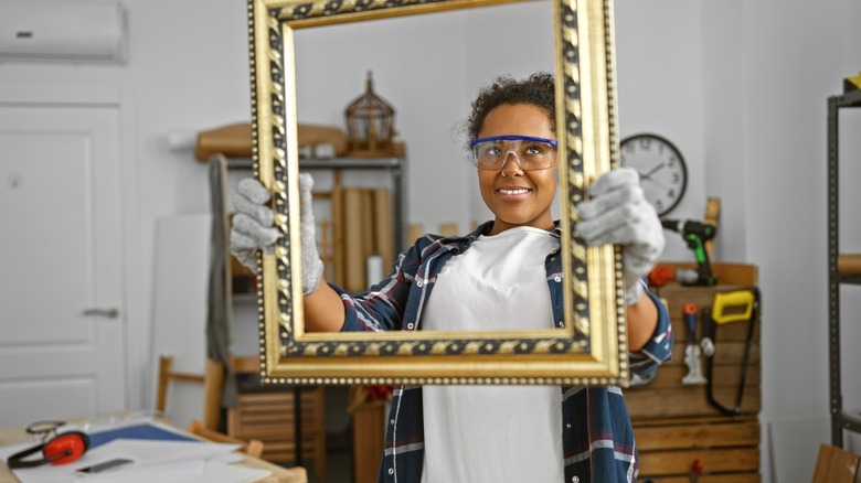 Reuse A Thrifted Frame To DIY A Clever Tool Organizer For Your Garage