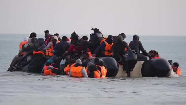 Watch: Migrants cling to overloaded small boat as over 1,000 cross ...