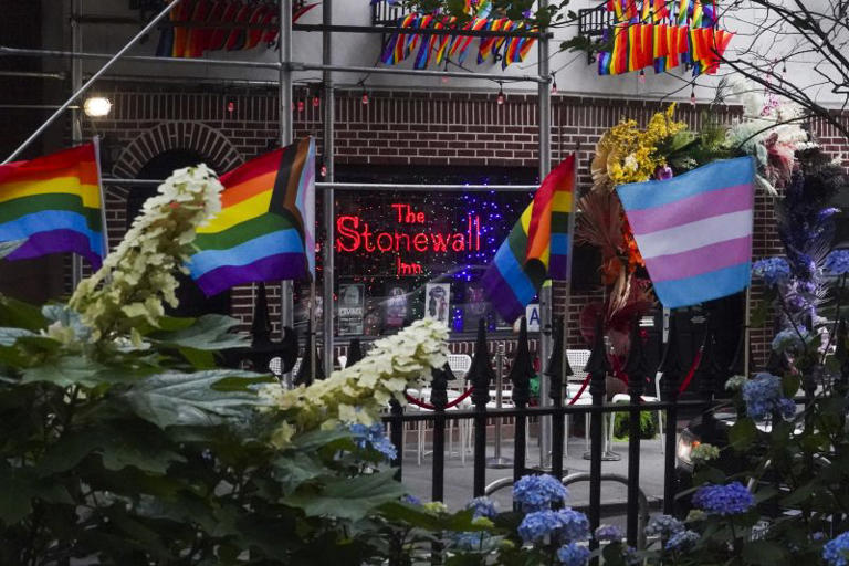 Pride flags surround Stonewall National Monument for Pride Month in NYC