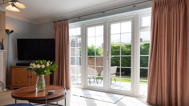 A Brilliant Curtain Rod Hack For Big Windows And Small Budgets