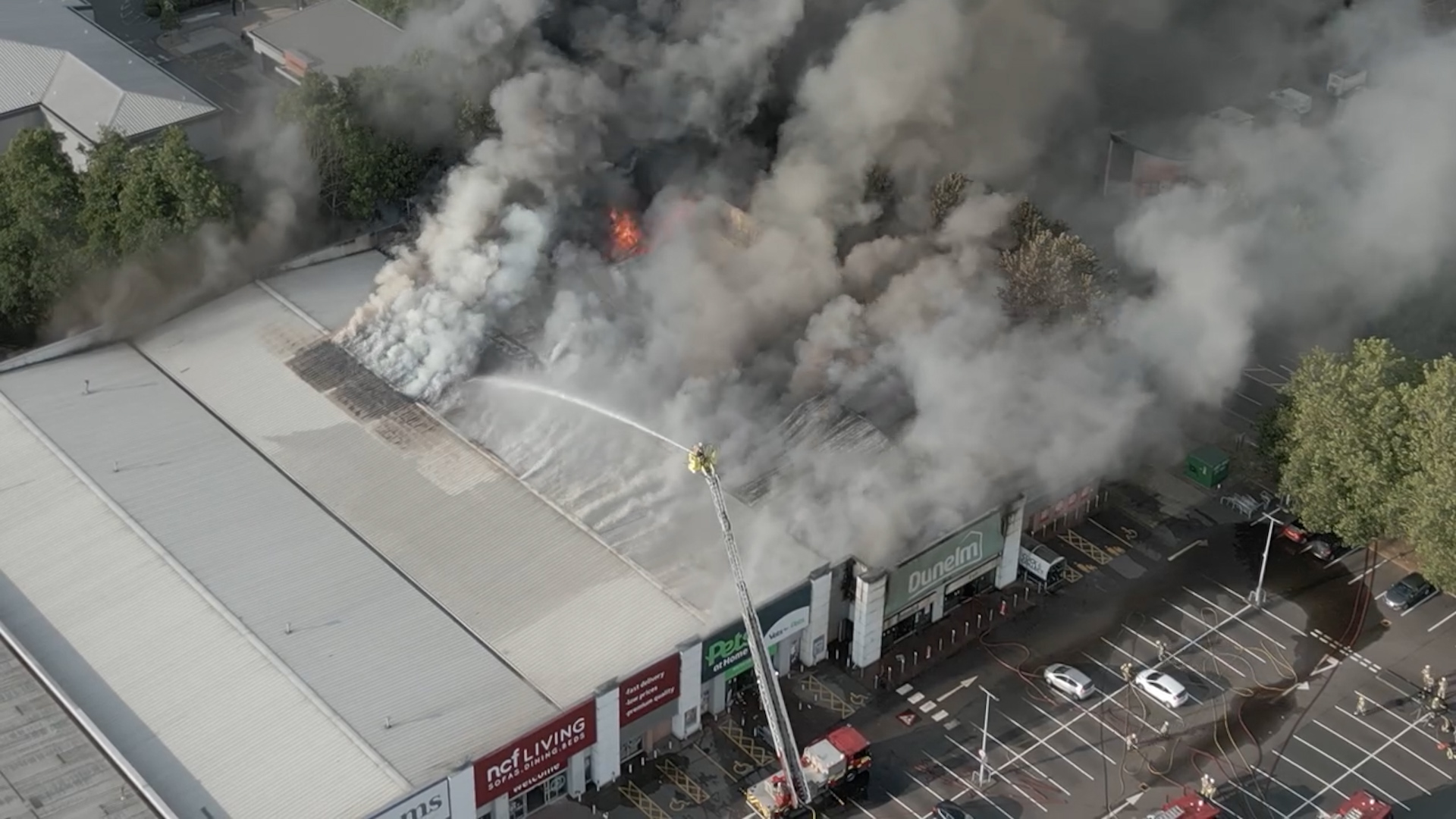 Three arrested after major fire at busy retail park