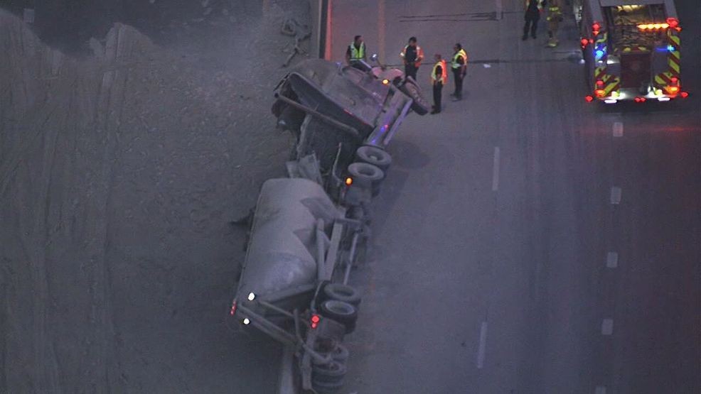 Cement truck overturns on Wurzbach Parkway, spilling load across ...