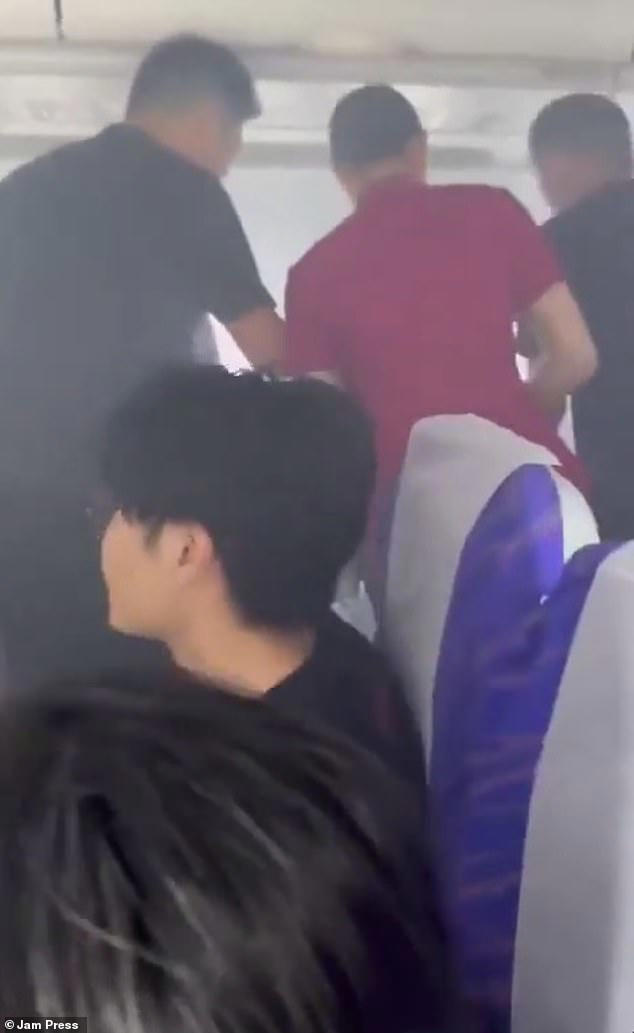 Moment airplane cabin fills with smoke after power bank EXPLODES just ...