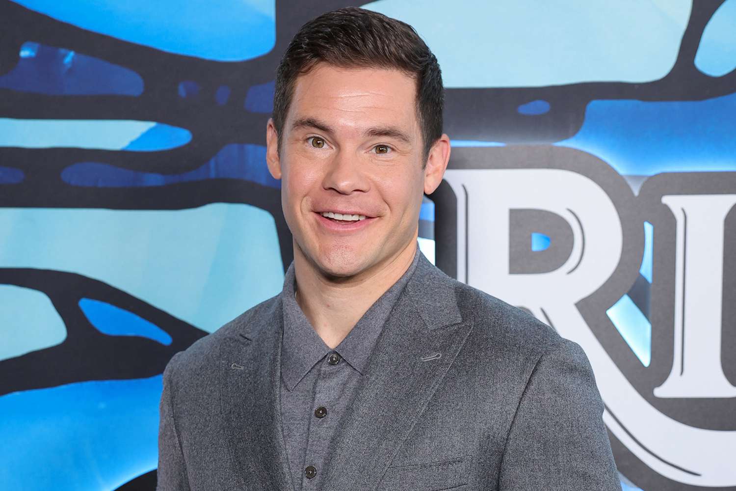 Adam Devine shows off scars from being hit by cement truck as a child ...
