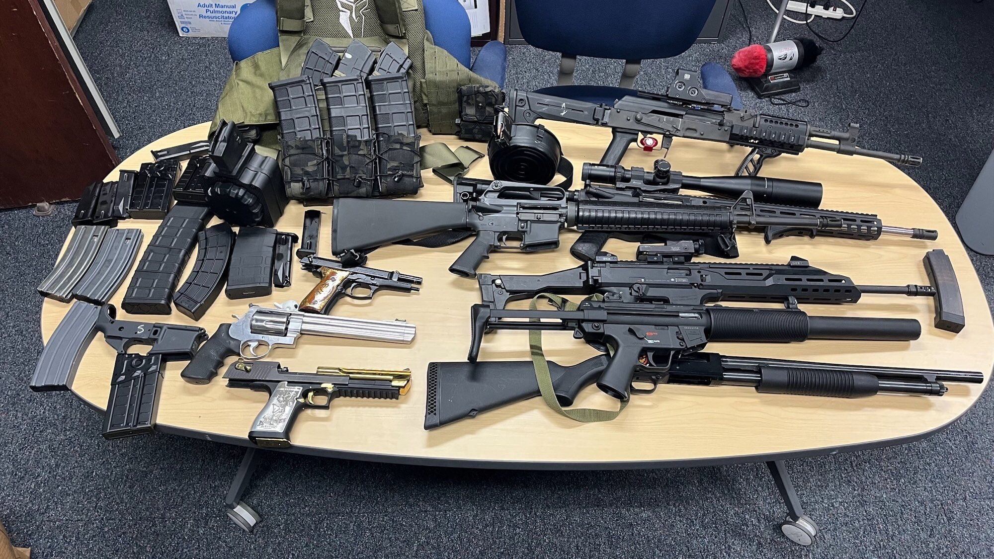12 guns, ammunition, body armor seized from local home