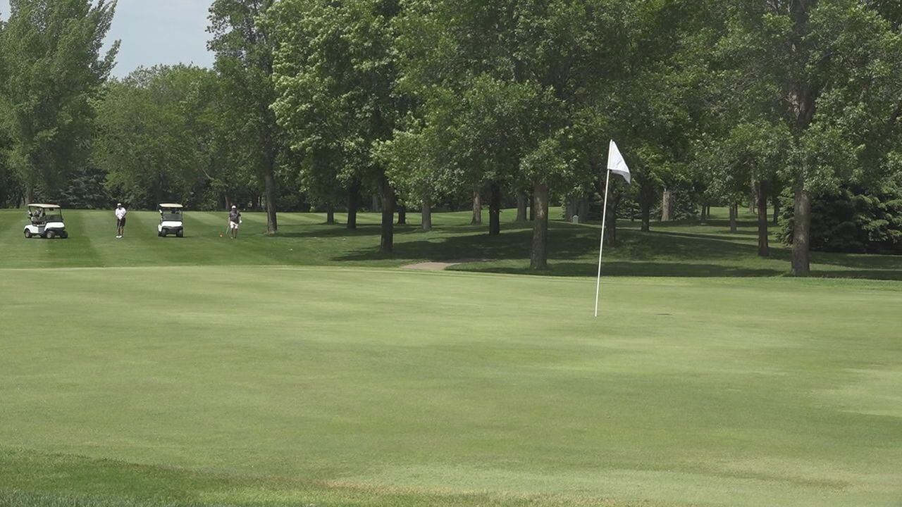Golfers participate in Junior Achievement’s 100 Hole Challenge