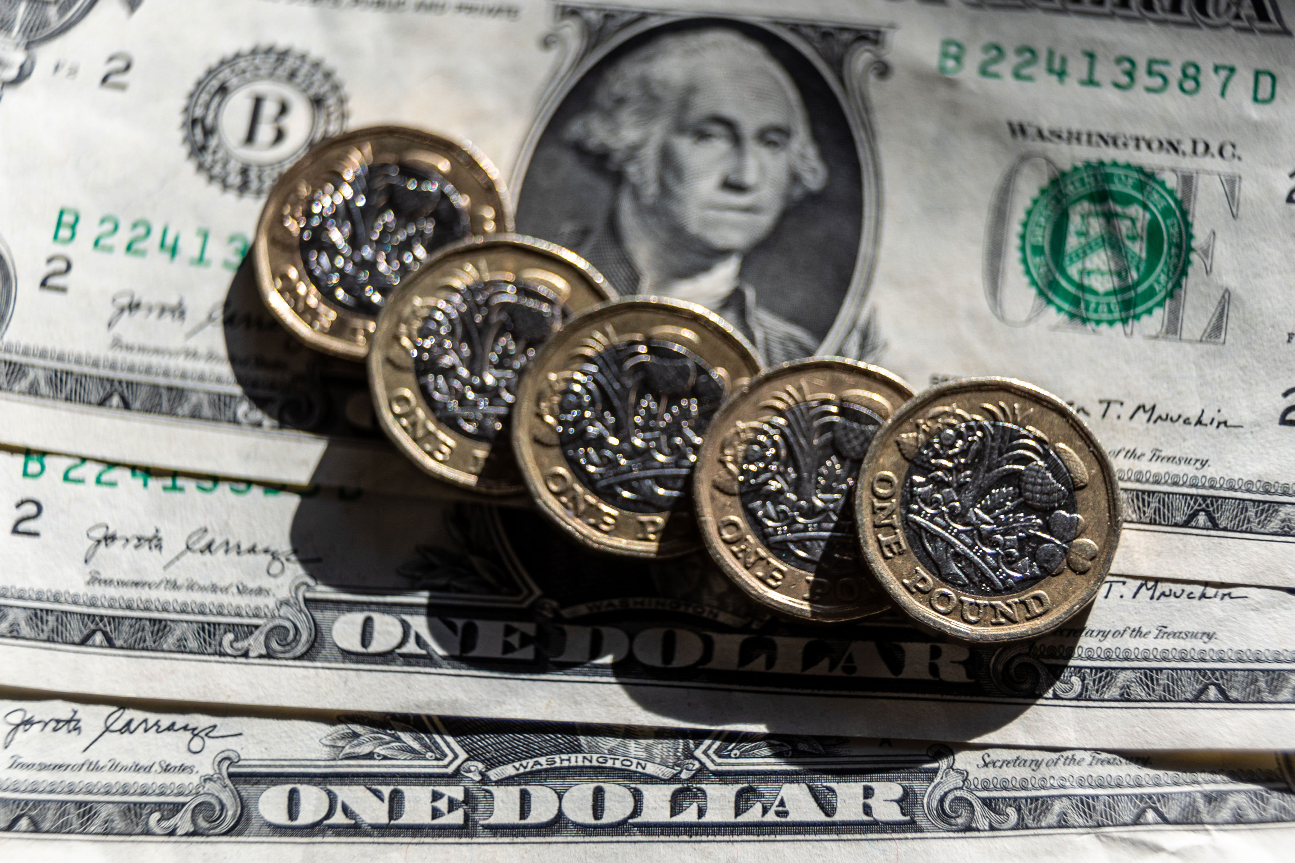 Pound edges lower following economic growth forecast cut