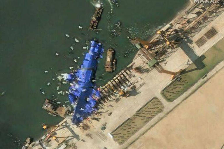 North Korea's brand new warship still capsized weeks after sinking in front of Kim Jong-un