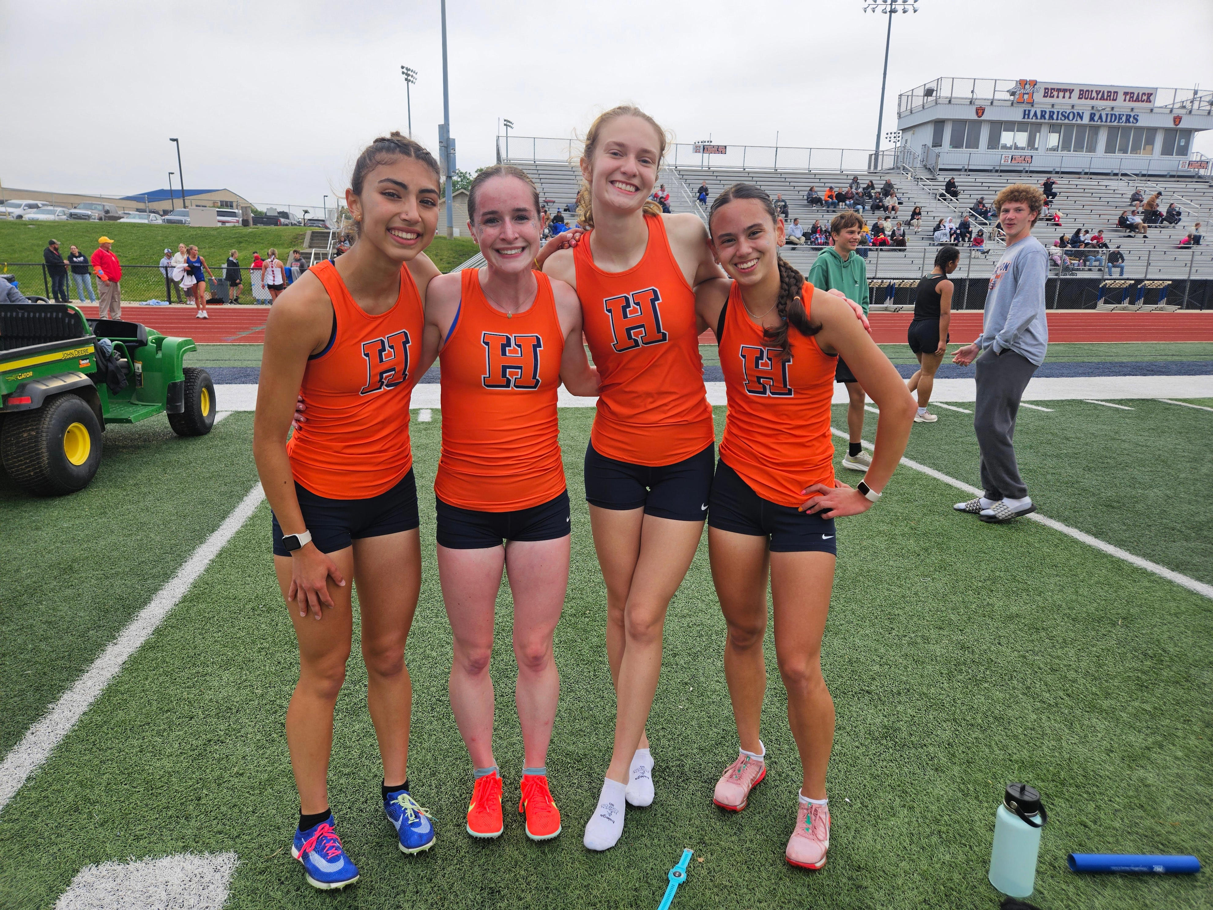 Beating the storm: Harrison girls track and field shred two records ...