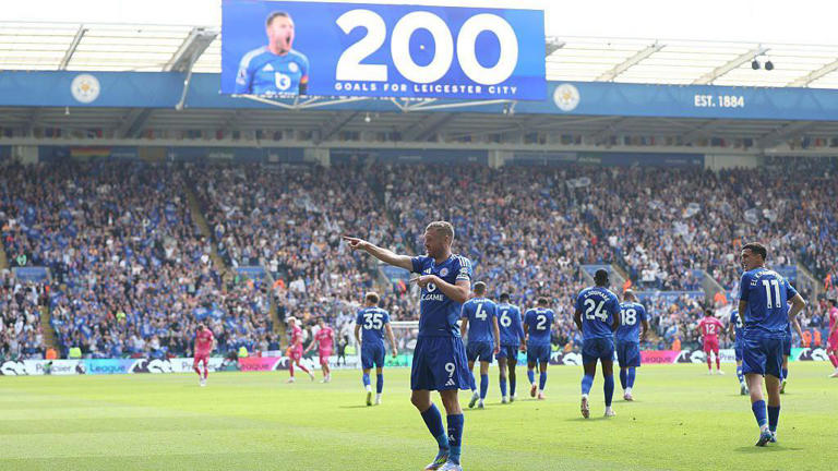 'Holding the corner flag aloft, victorious in his pursuit'