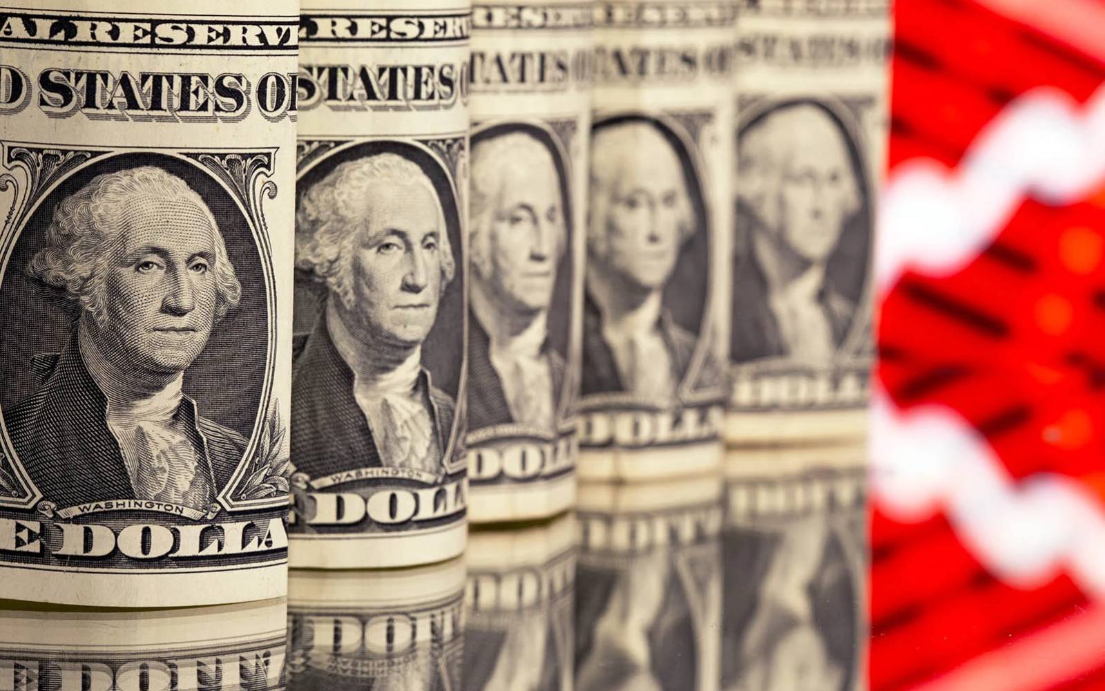 Dollar reels on criminal probe into Powell, gold hits record high