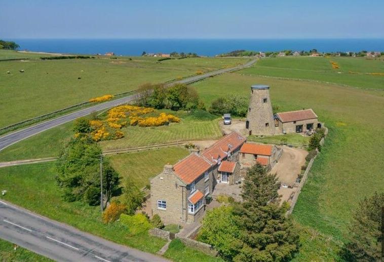 Inside detached Ravenscar home with light, space and fantastic sea views