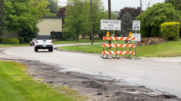 Barricades, signs installed to curb cut-through traffic on street in ...