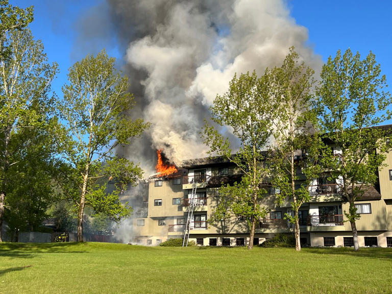 Crews battle large apartment fire near high school in Prince George