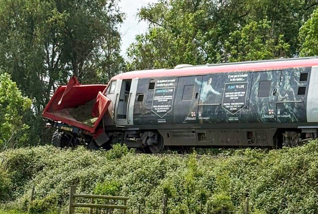 Several injured after train hits tractor at level crossing