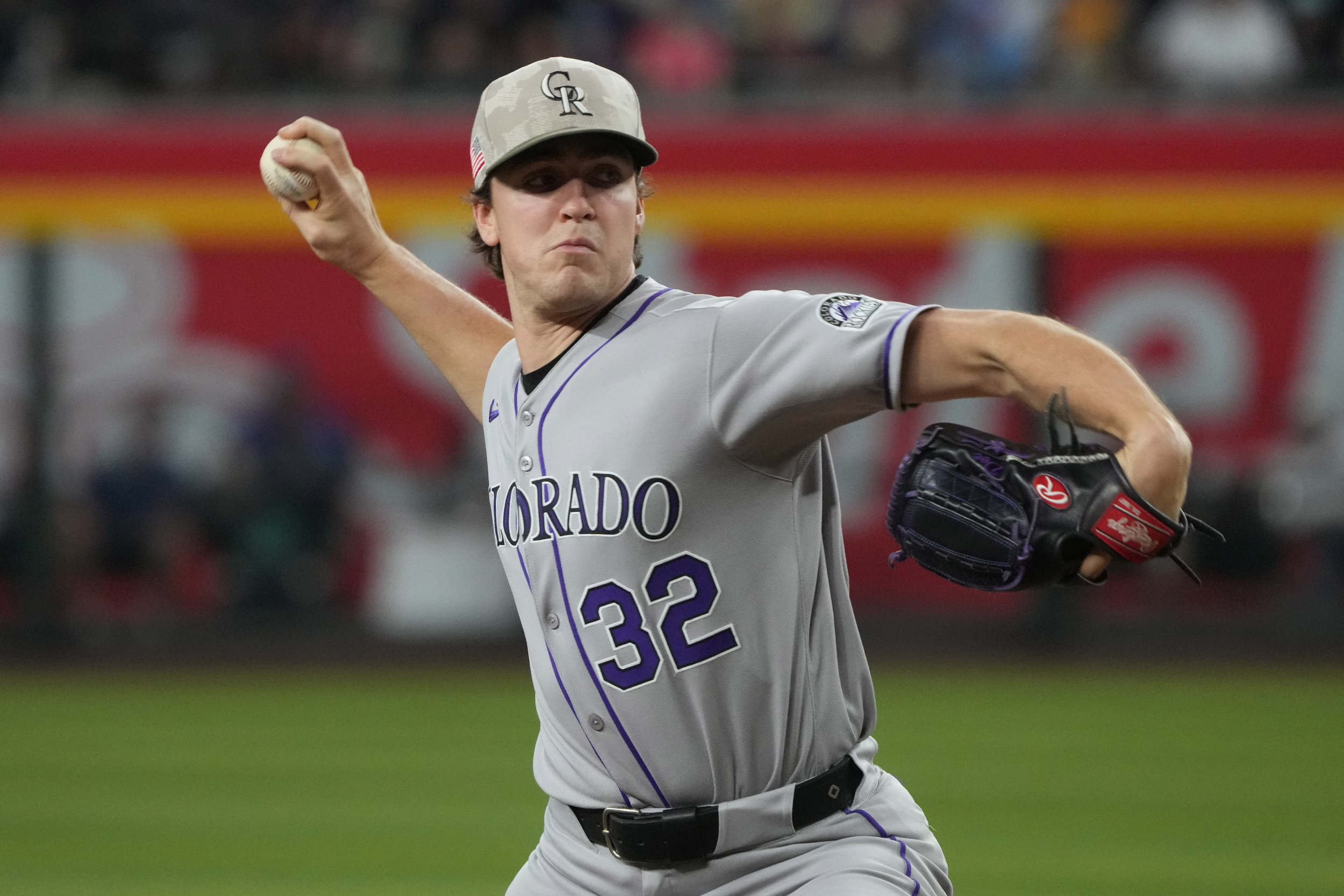 Rockies place top young pitcher on IL with forearm tightness
