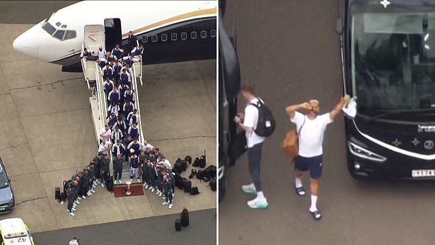Spurs stars pose with Europa trophy after landing back in England