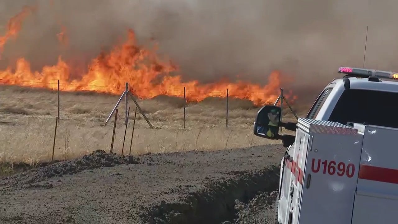 Crews battle wind-driven Midway Fire near Tracy