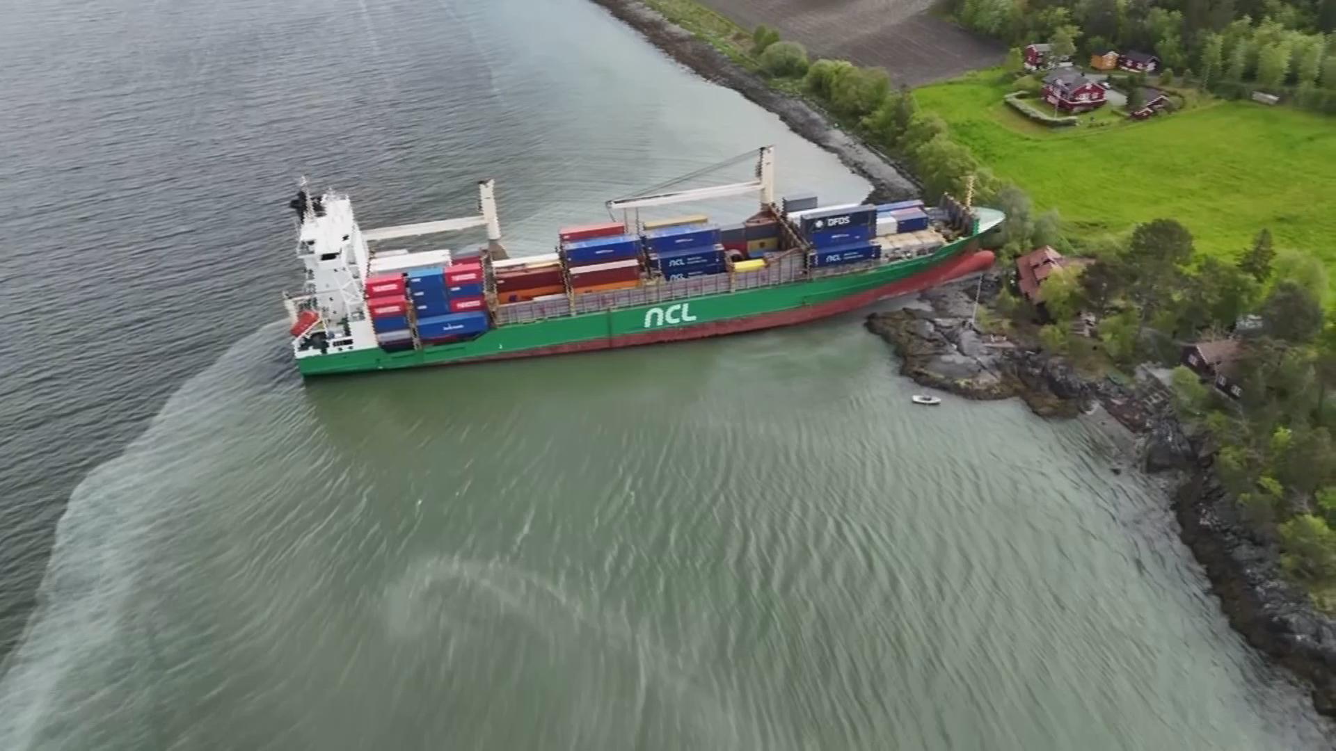 Container ship runs aground near Norwegian seaside home