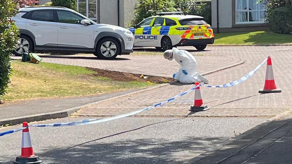 Masked gang slash man outside home as feud escalates