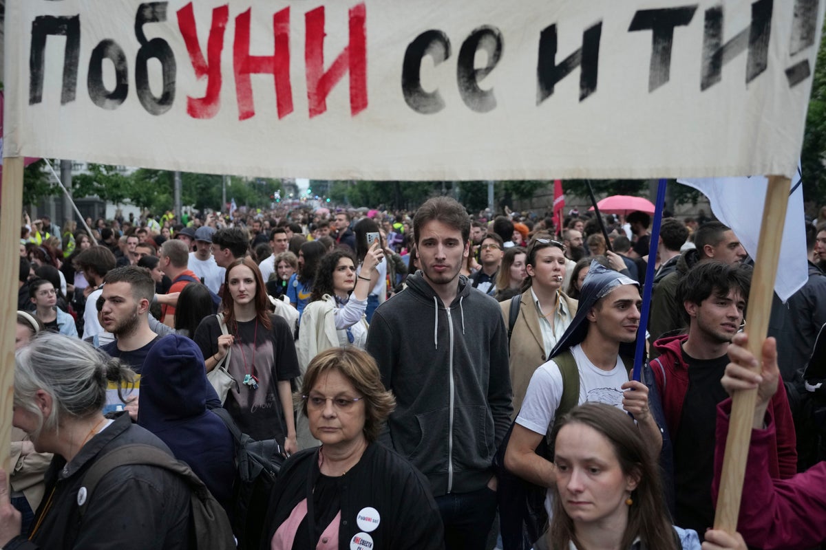 Thousands brave heavy rain to protest Serbia's crackdown on universities