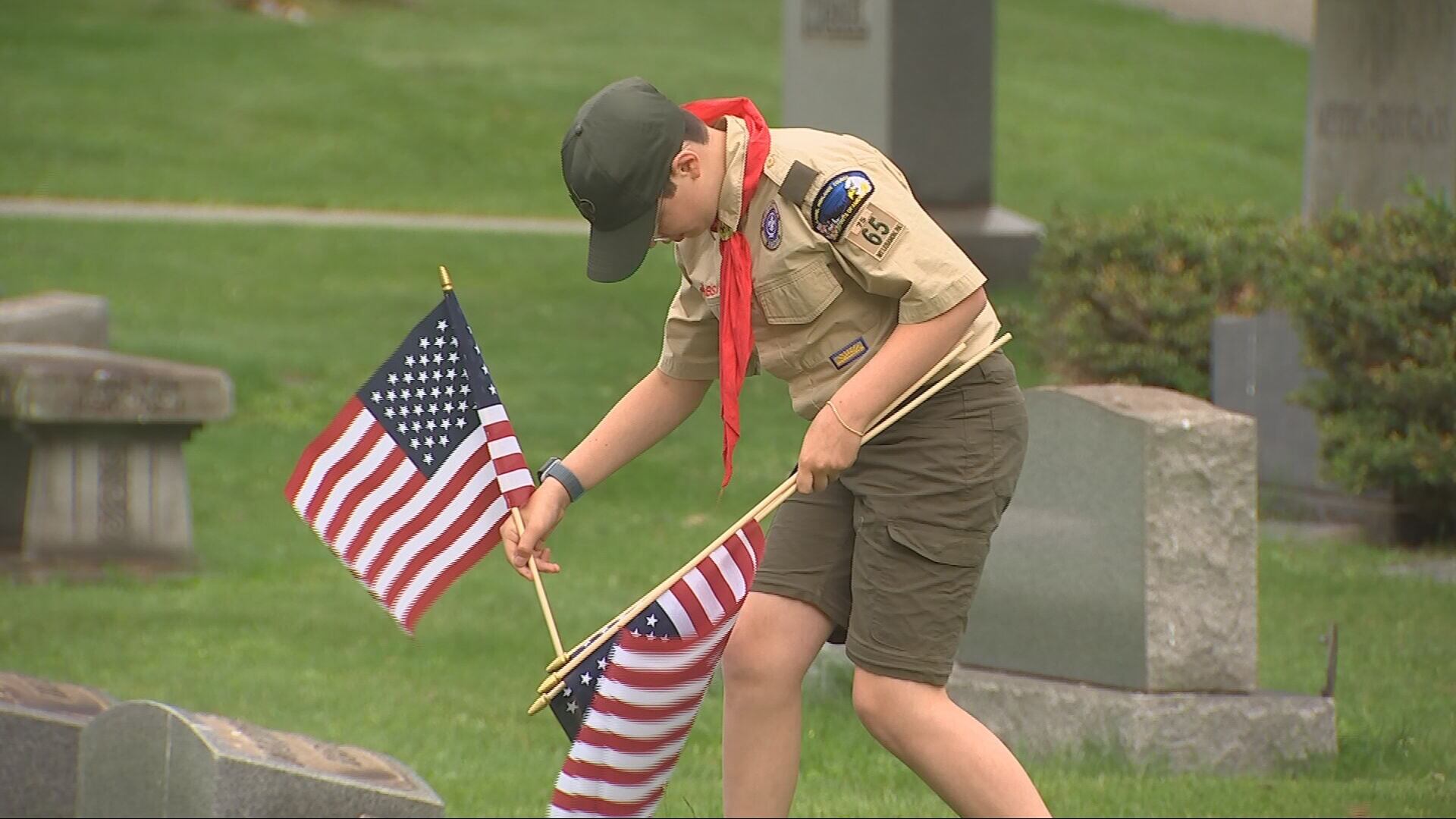 Volunteers join Scouts in placing flags at veterans’ graves in local ...
