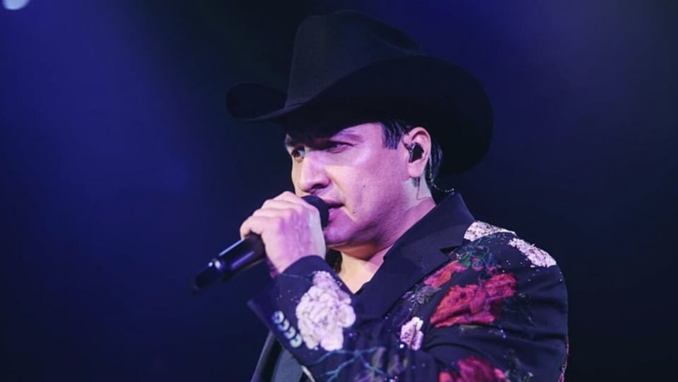 Why did Mexican singer Julion Alvarez postpone his US show?