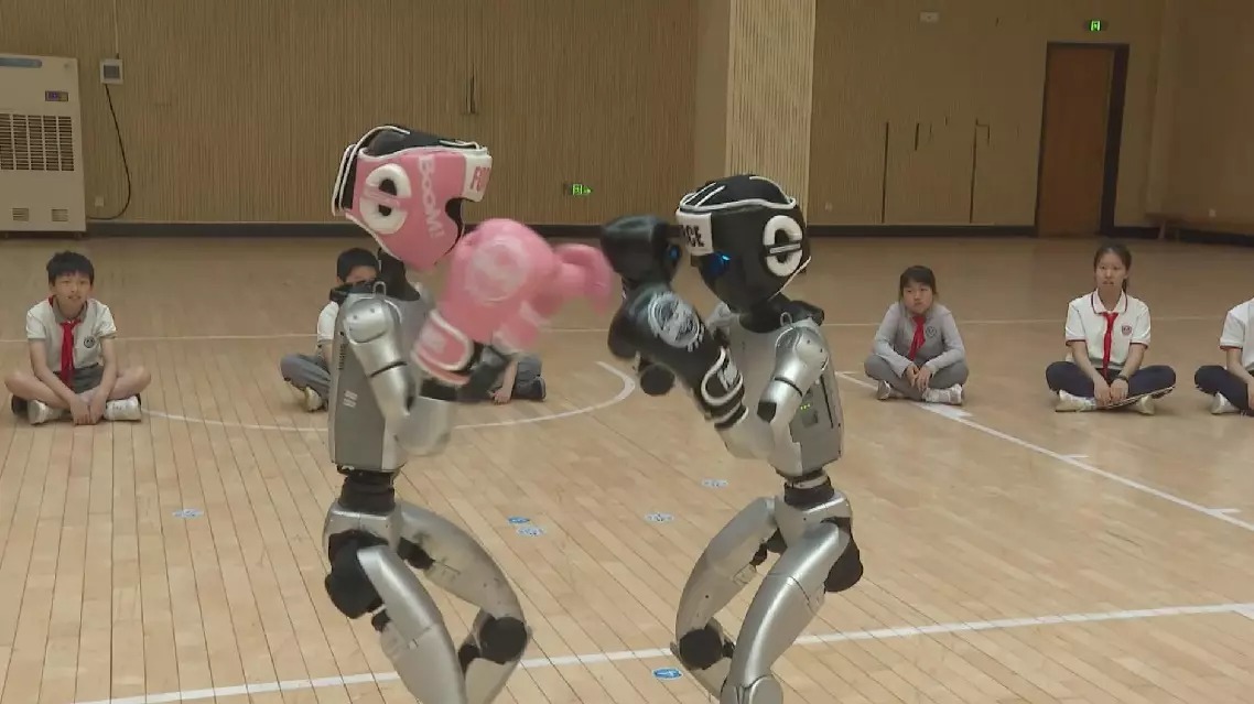 Unitree's Combat Robots Turn School Gym Into Boxing Arena