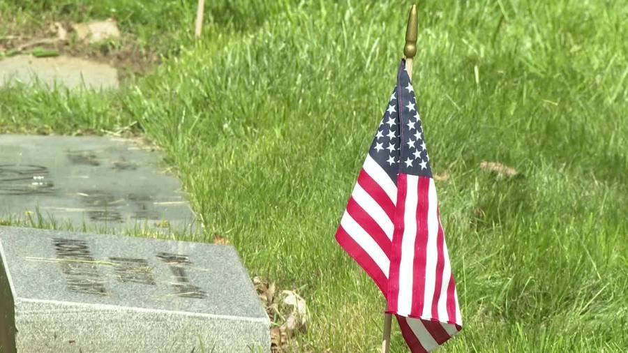 Flags placed on service members’ graves at Lake View Cemetery for ...