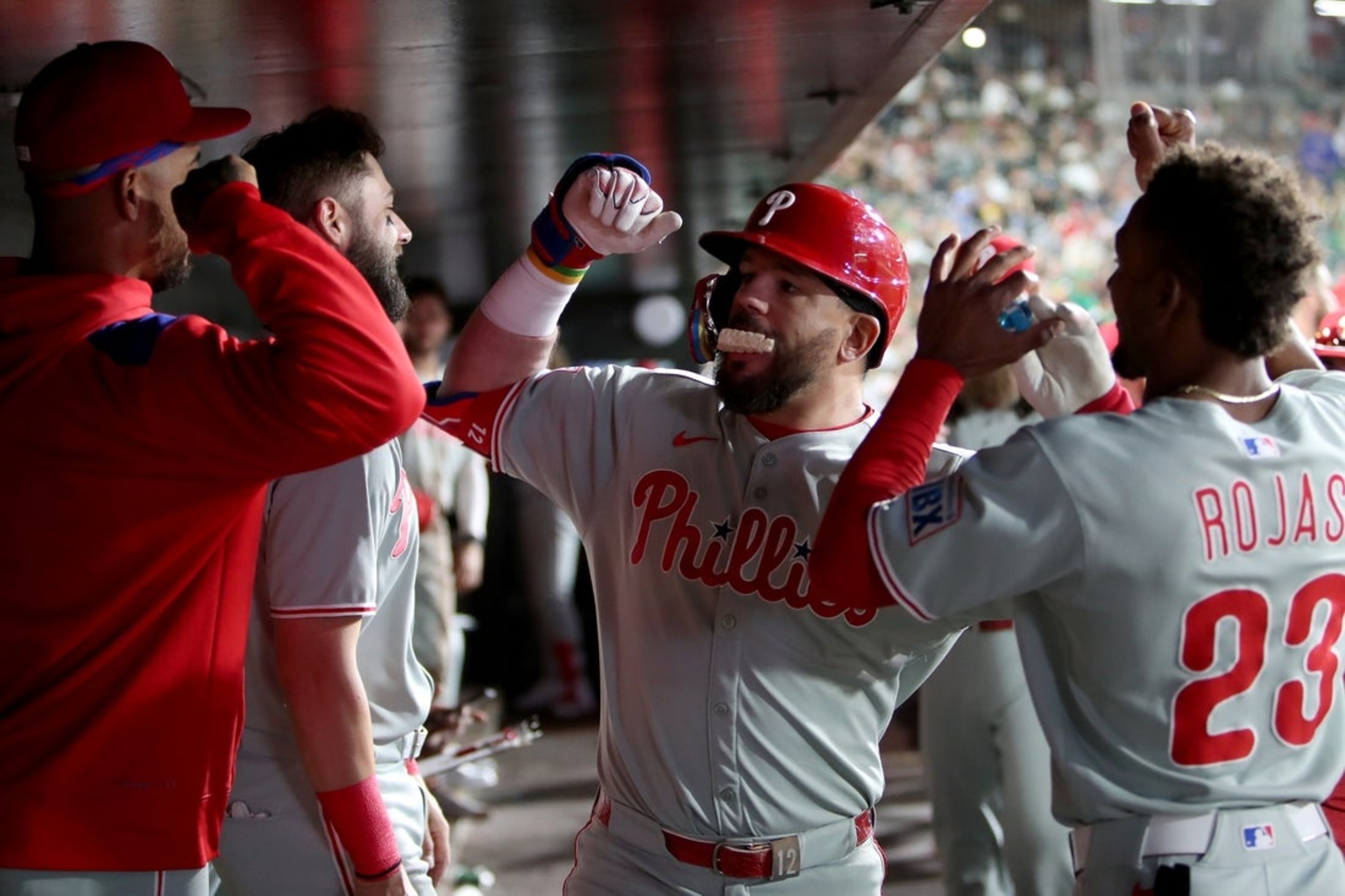 Phillies rally late, beat A's in 11 for 9th straight win