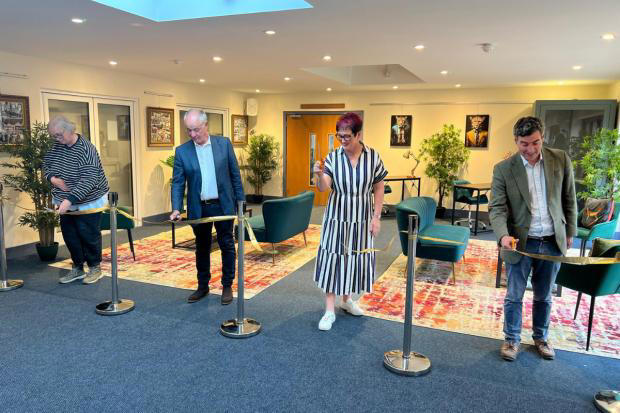 New community hub opens with work spaces and picnic benches