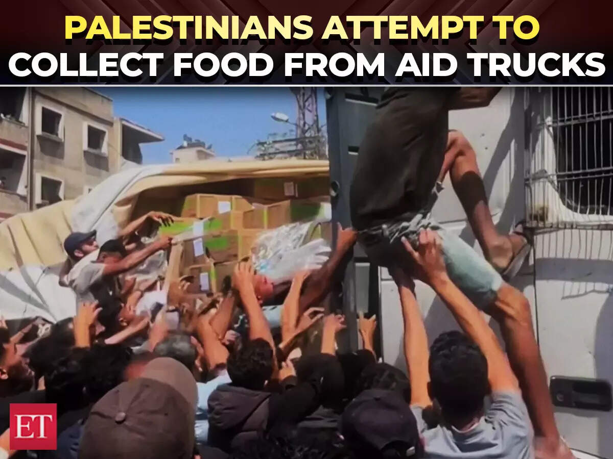 Palestinians attempt to get food parcels as aid trucks arrive in Gaza City