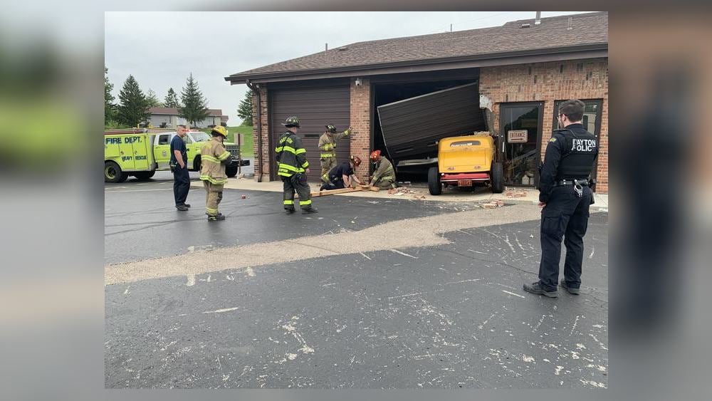 Mechanic test-driving car crashes into building