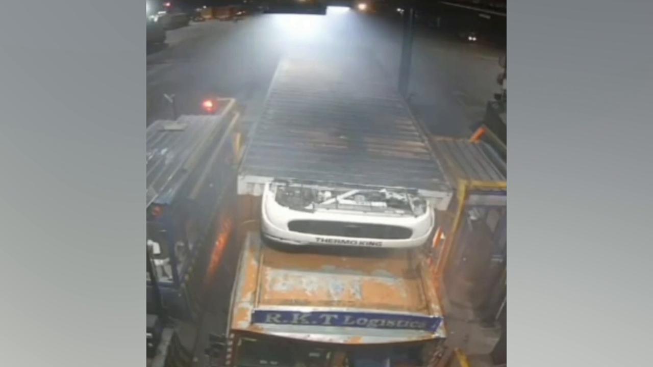 Truck crashes into toll booth and bursts into flames in India
