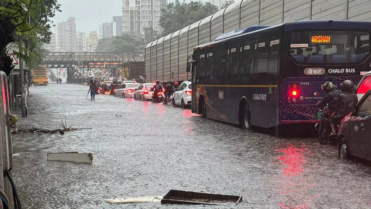 Trains crawl, roads waterlogged, buses diverted as Mumbai reels under heavy rain; 'orange' alert ...