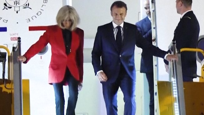 Emmanuel Macron 'pushed in the face by his wife' after touching down in ...